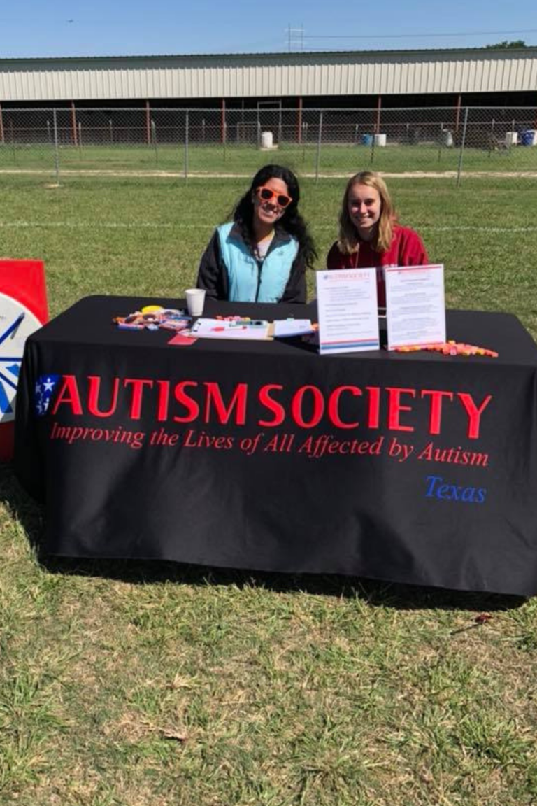 Interns at table Support – Autism Society of Texas